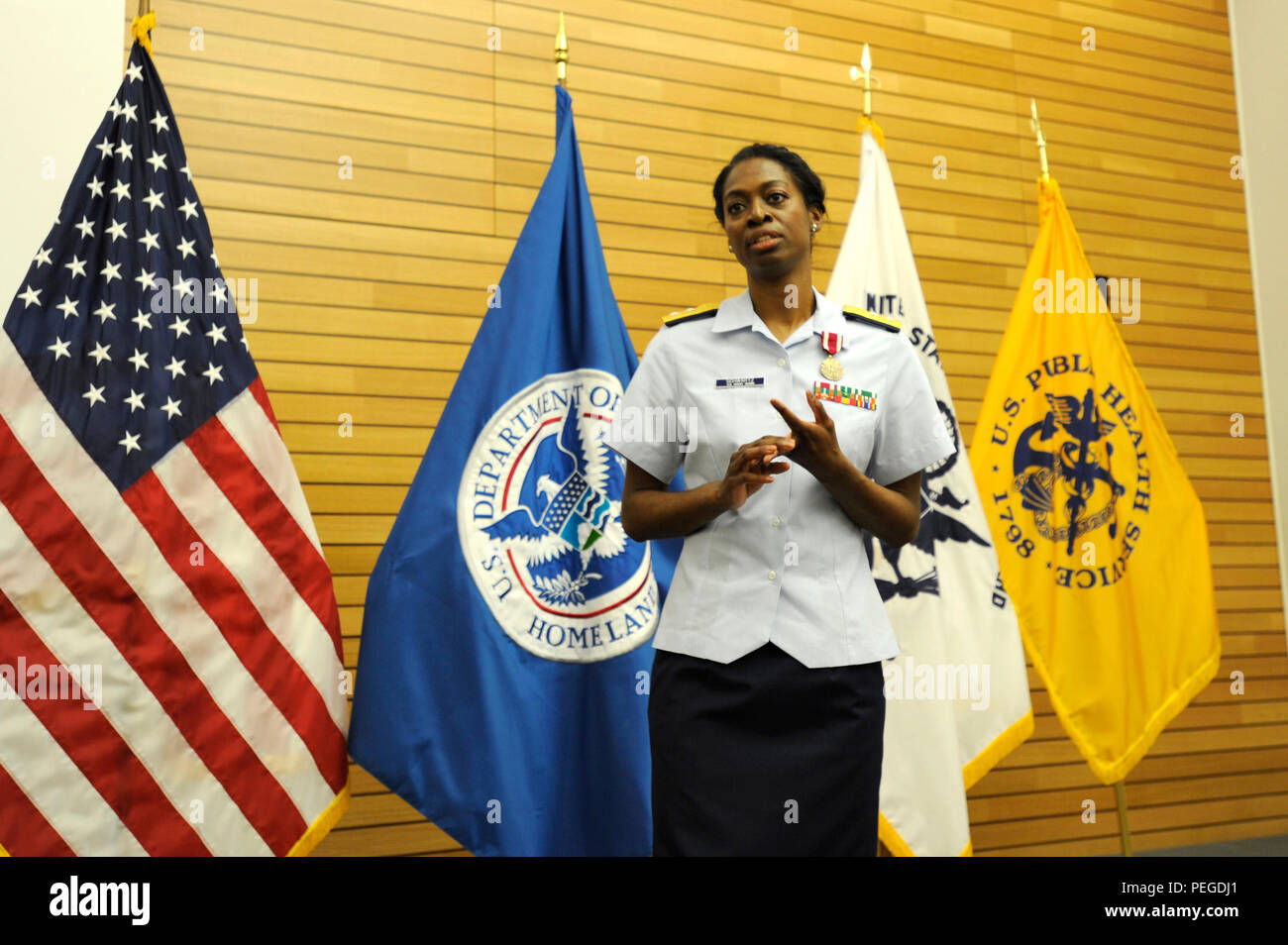 Rear Adm. Erica Schwartz speaks to attendees of her frocking ceremony ...