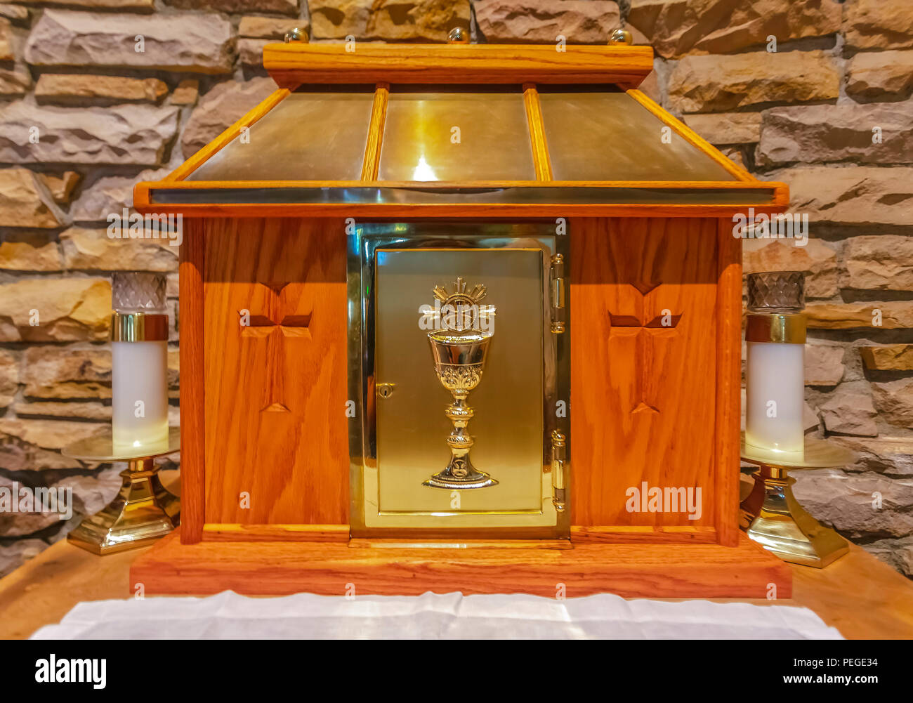 Donation box in a modern church with golden embellishments and locked ...
