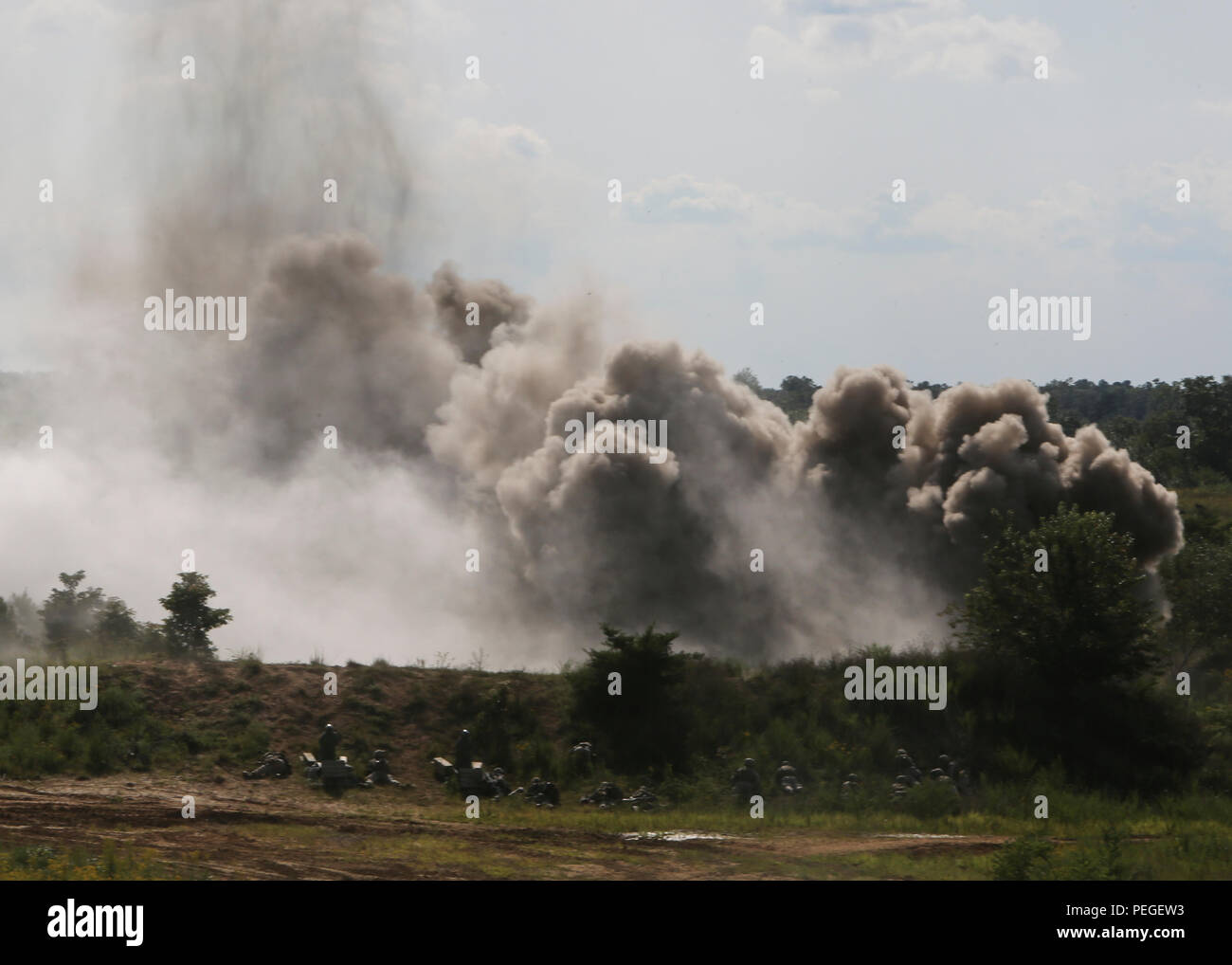 Marines with Alpha Company, 2nd Combat Engineer Battalion, take cover ...