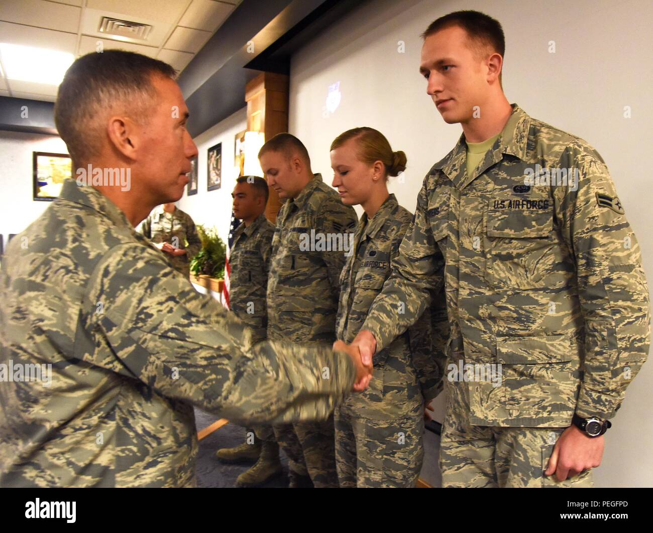 Airmen Against Drunk Driving volunteers receive commander’s coins from ...