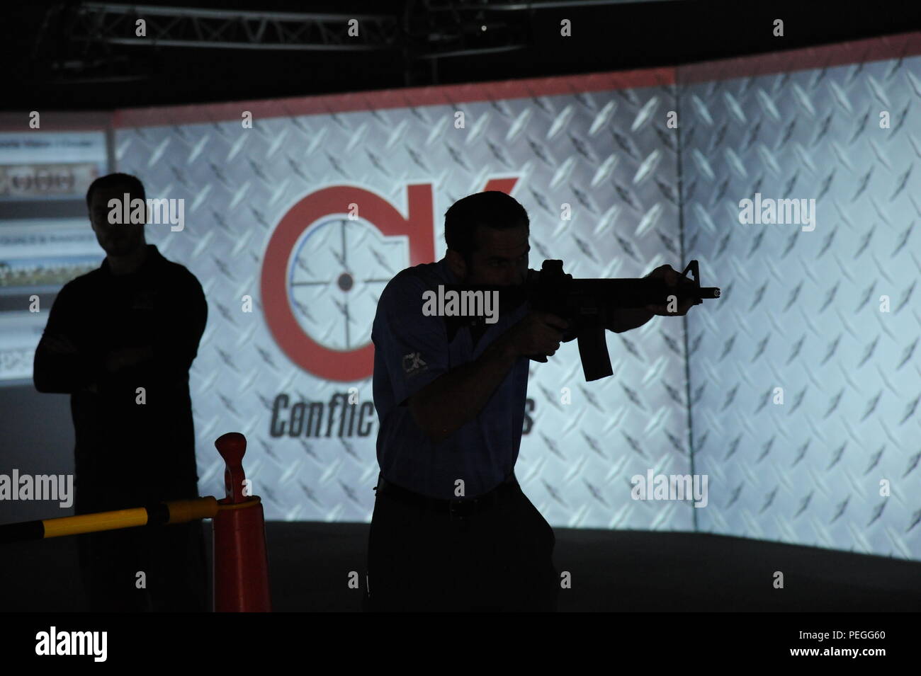 An employee of Conflict Kinetics demonstrate techniques to the invited ...