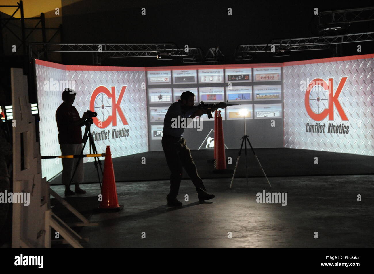 An employee of Conflict Kinetics demonstrate techniques to the invited ...