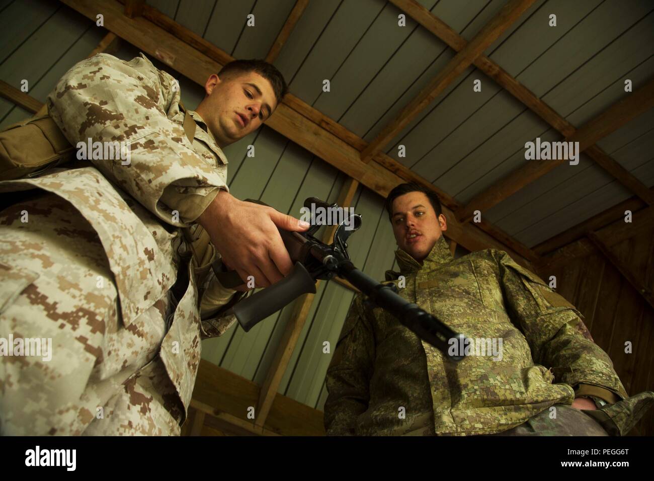 New Zealand Army Gunner Nathan Cookson, right, supervises Lance Cpl ...