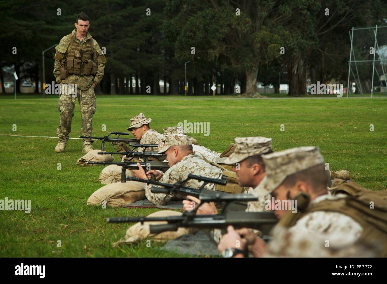 New Zealand Army Gunner Sean Mitchell supervises U.S. Marines as they ...