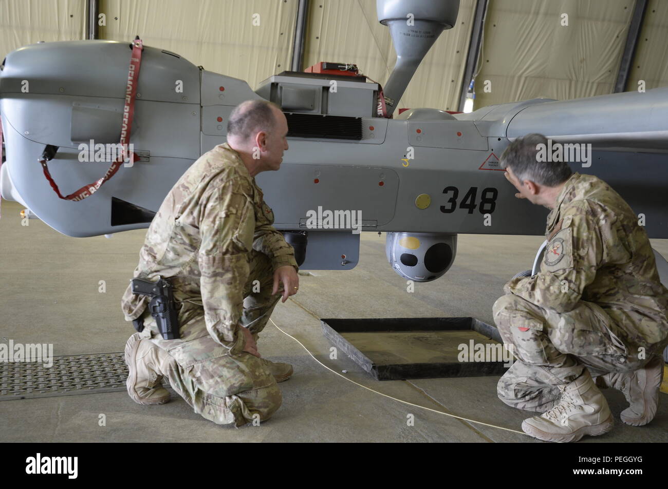 The MQ-5B Hunter unmanned aerial vehicle is inspected by U.S. Navy ...