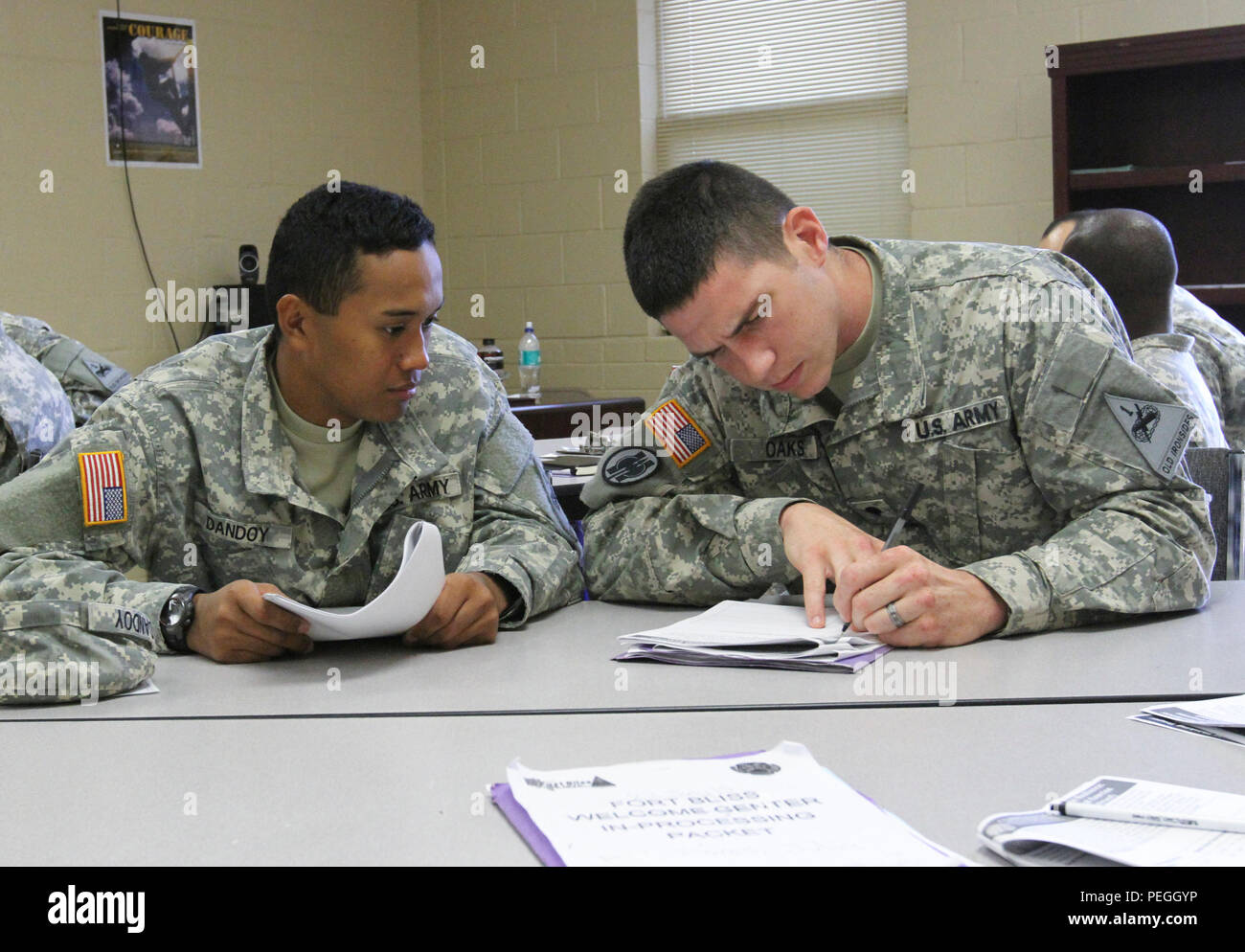 Incoming Soldiers, Pvt. Renato Dandoy and Spc. William Oaks, work ...
