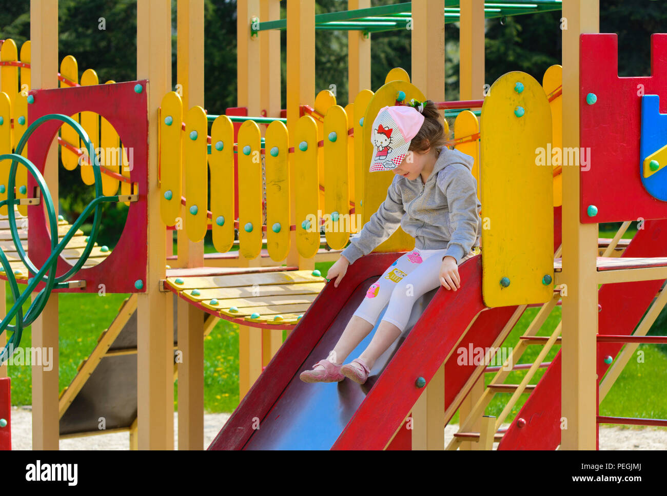 Little children run around and play in the playground. Game center for ...