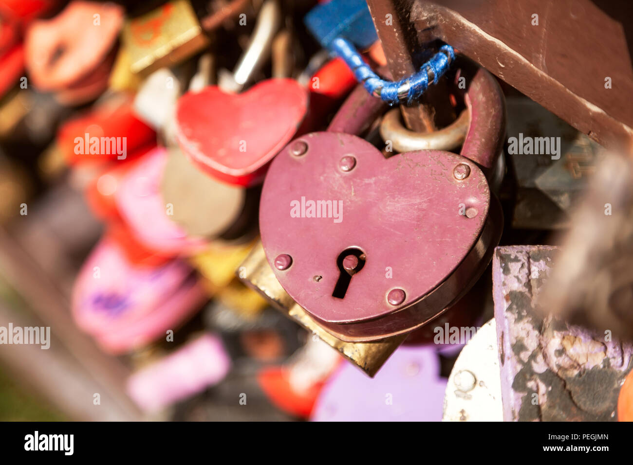 City landscape. Metal bridge with a lot of colorful locks. Wedding ...