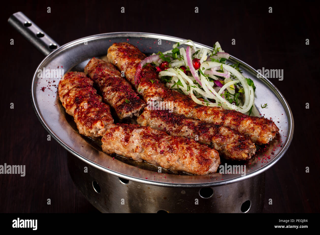 Grilled meat kebab with onion Stock Photo - Alamy