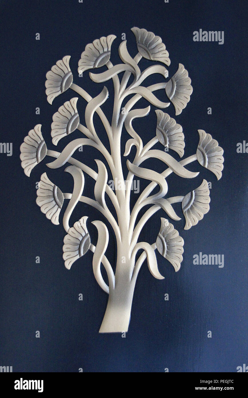 Engraved ivory wall plaque having nice floral design on dark blue ...