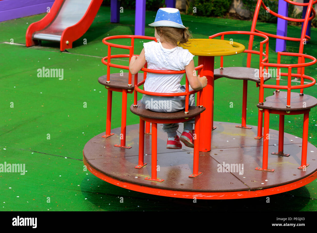 Little children run around and play in the playground. Game center for ...