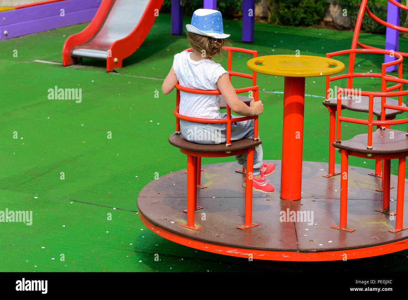 Little children run around and play in the playground. Game center for ...