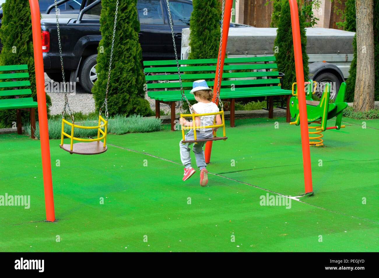 Little children run around and play in the playground. Game center for ...