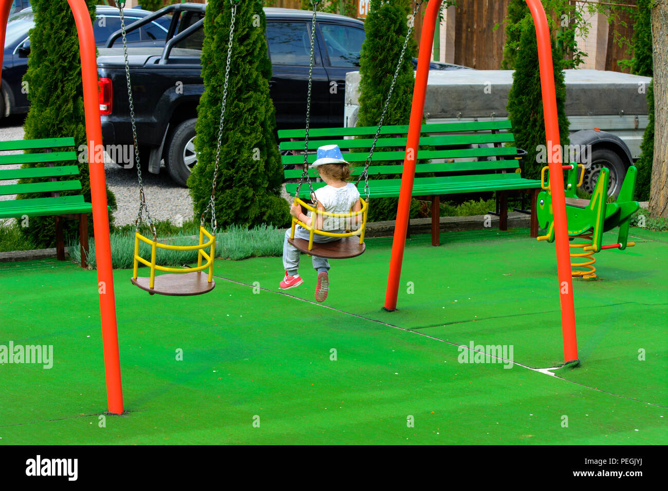 Little children run around and play in the playground. Game center for ...