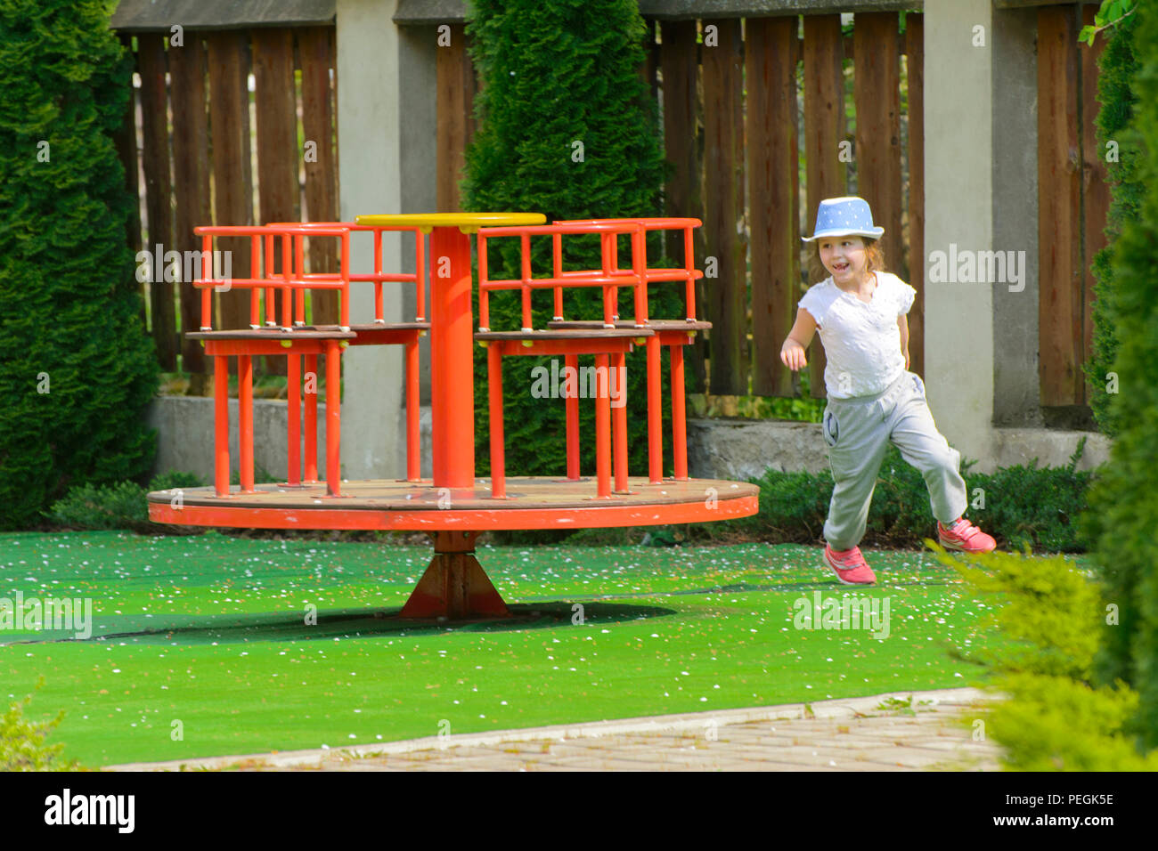 Little children run around and play in the playground. Game center for ...