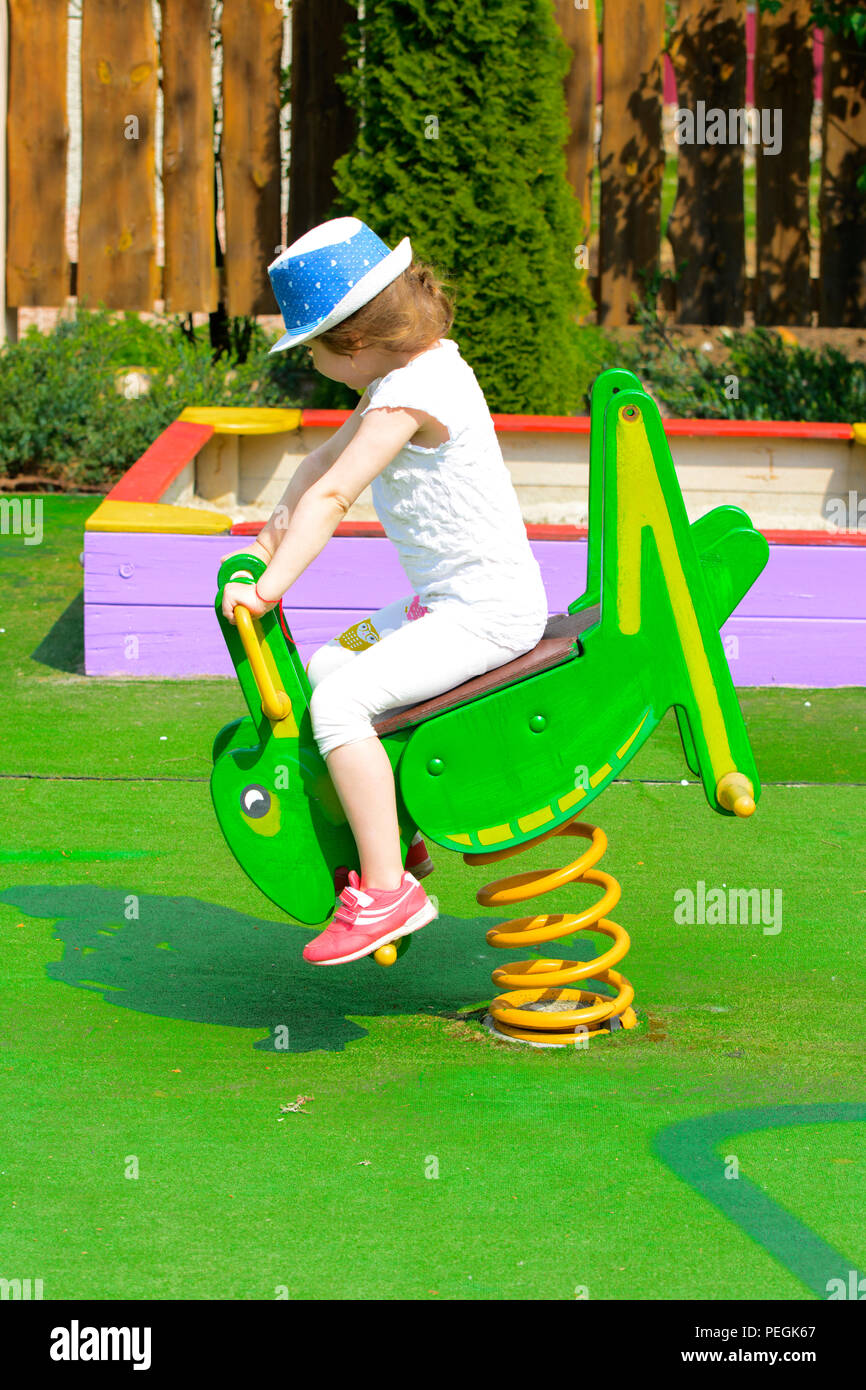 Little children run around and play in the playground. Game center for ...