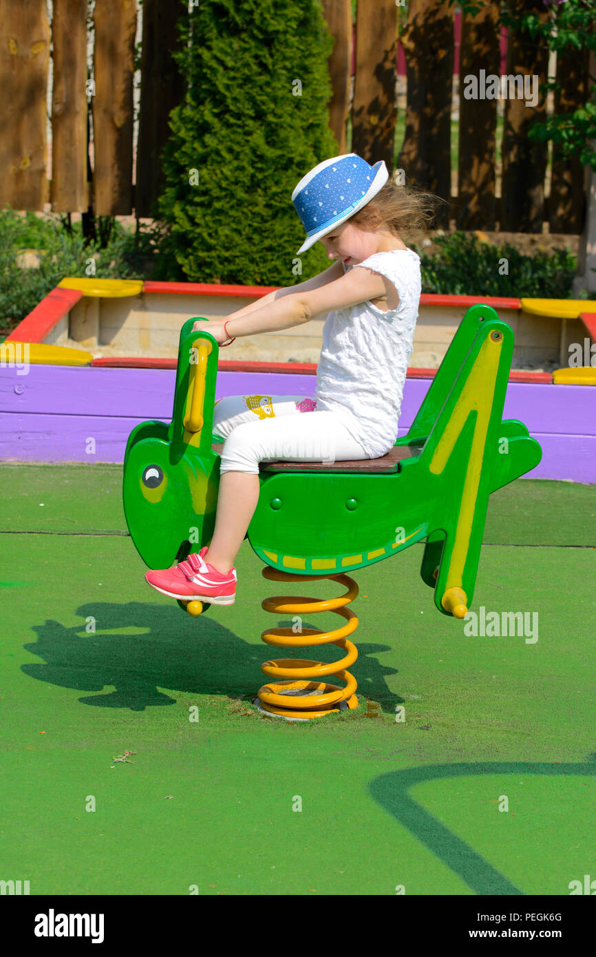 Little children run around and play in the playground. Game center for ...