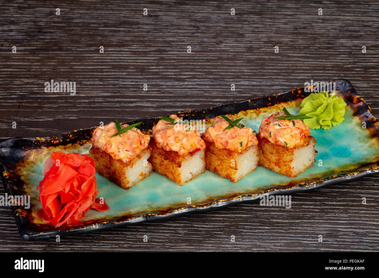 Crispy rice roll with tuna and wasabi Stock Photo - Alamy
