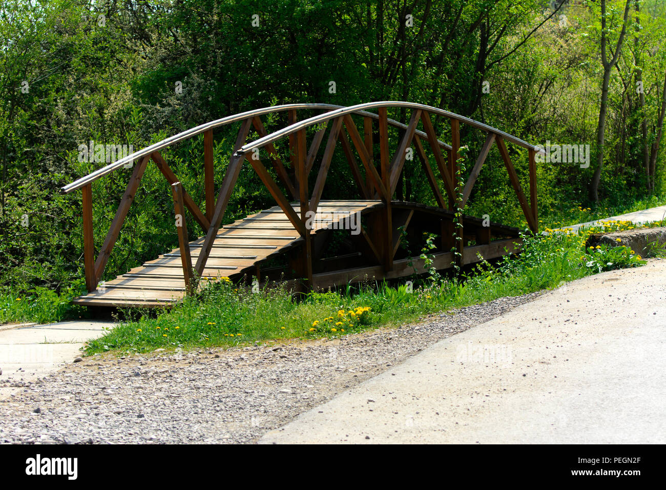 Deformed and dilapidated old wooden bridge over the canal, the concept ...