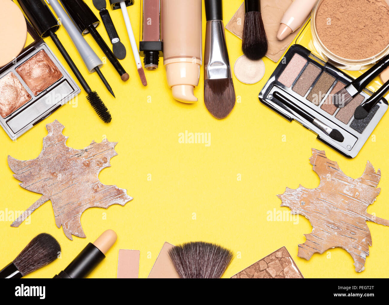 Autumn makeup background. Various make-up products brown and golden ...
