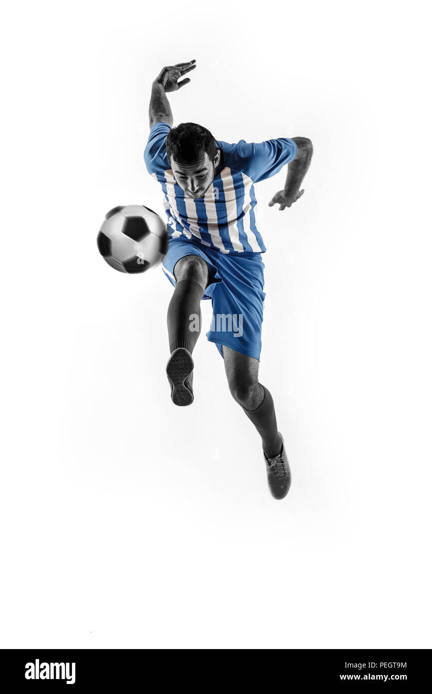Professional football soccer player with ball isolated on white studio ...