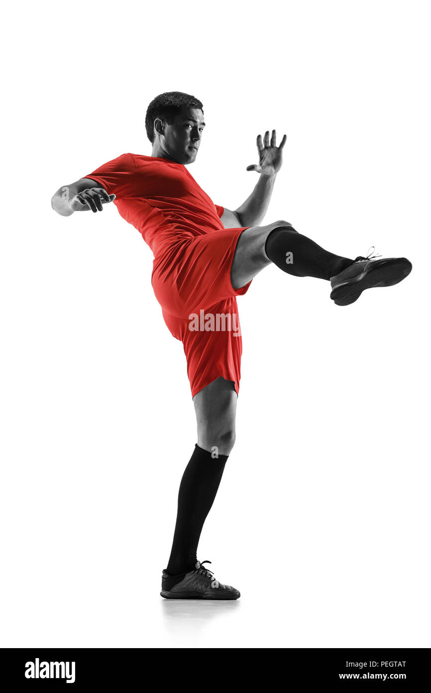Professional football soccer player in motion isolated on white studio ...