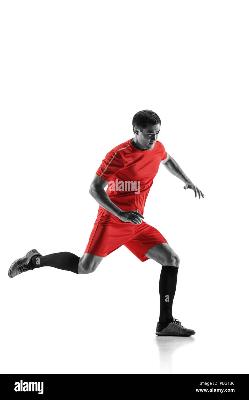 Professional football soccer player in motion isolated on white studio ...