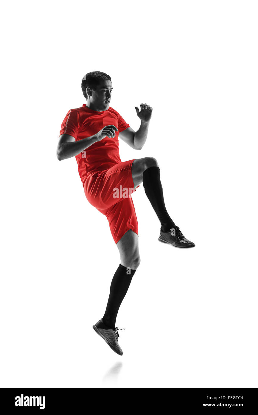 Professional football soccer player in motion isolated on white studio ...