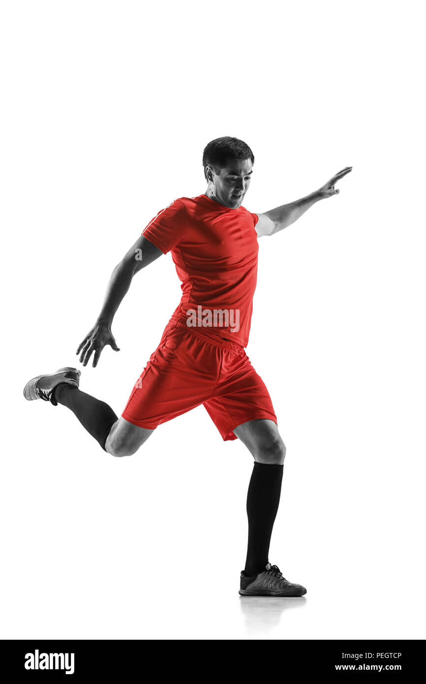 Professional football soccer player in motion isolated on white studio ...