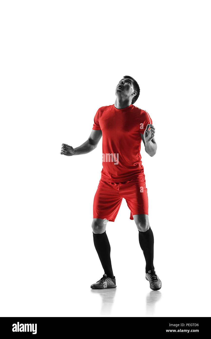 Professional football soccer player in motion isolated on white studio ...