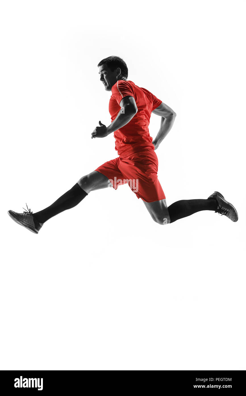 Professional football soccer player in motion isolated on white studio ...