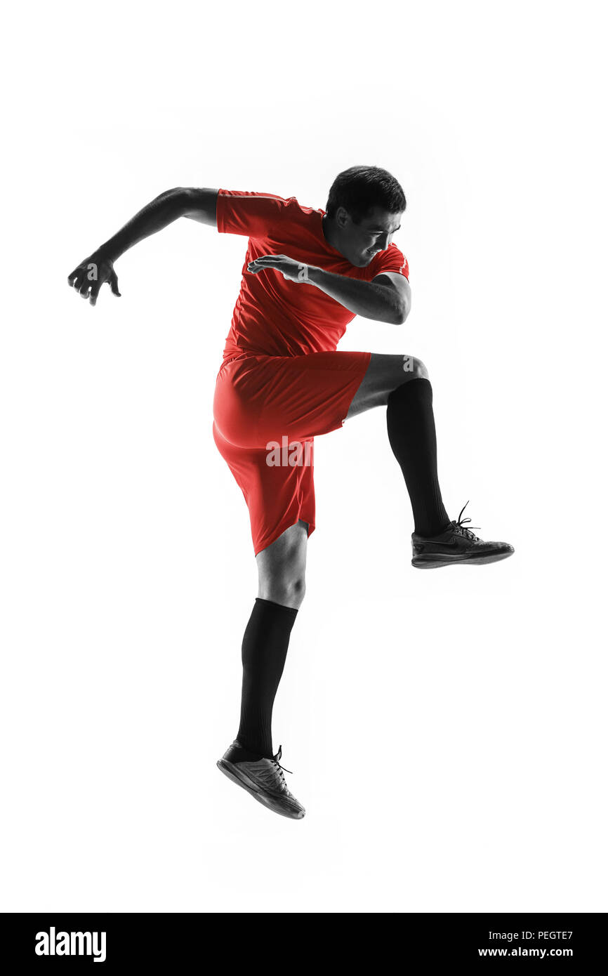 Professional football soccer player in motion isolated on white studio ...