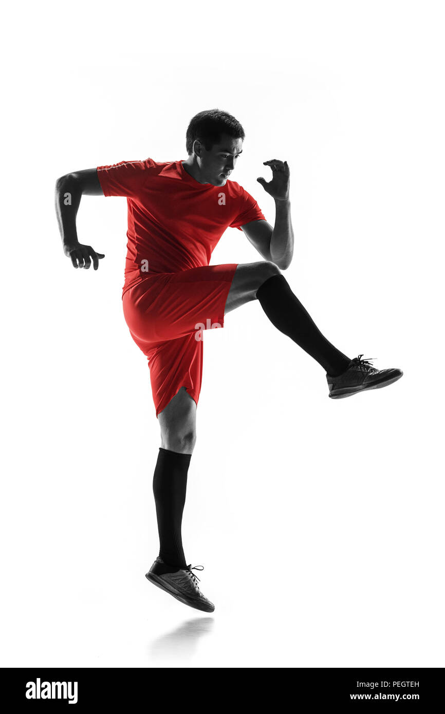 Professional football soccer player in motion isolated on white studio ...