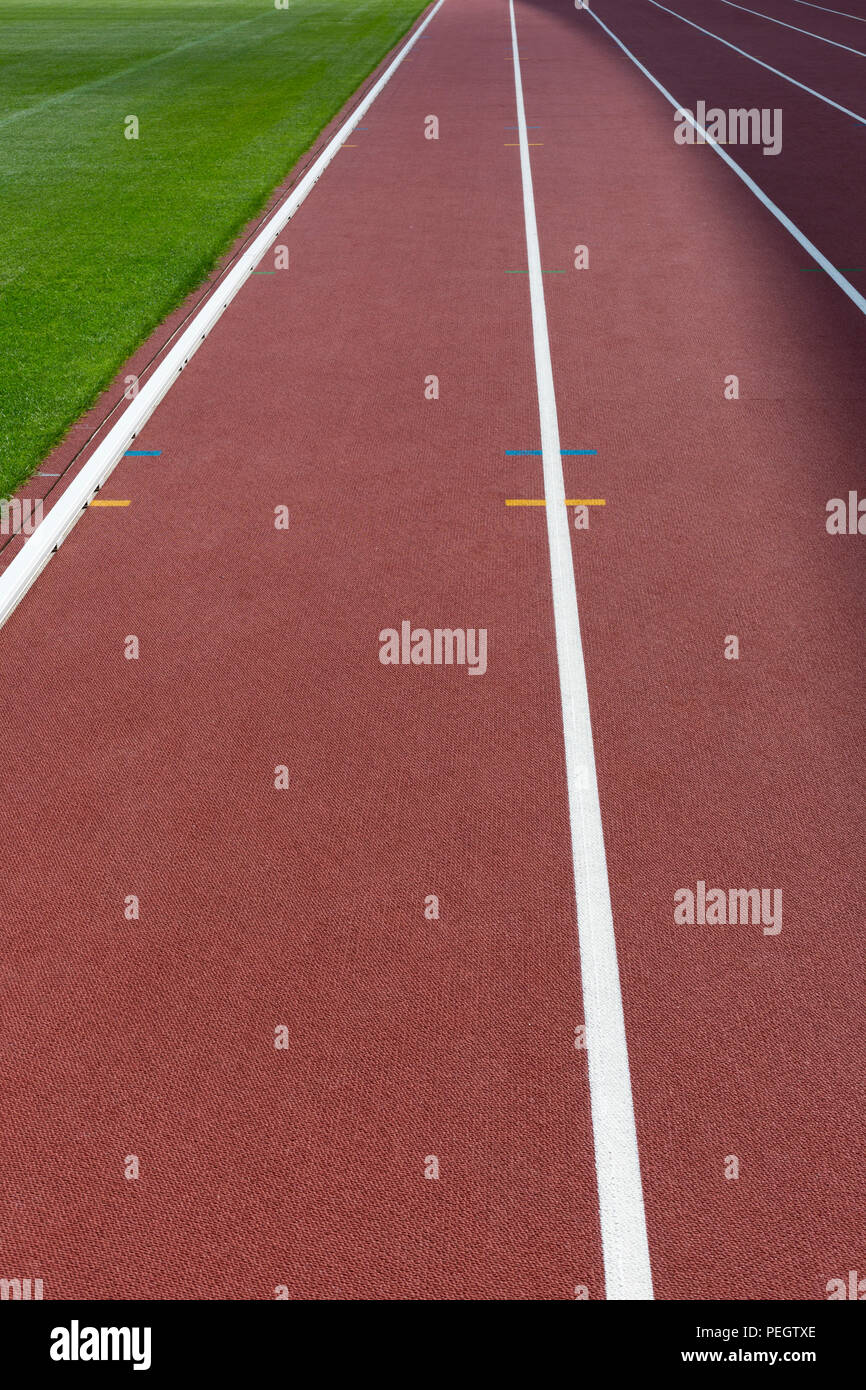 Red sport track for running on stadium close-up shot. Running healthy ...