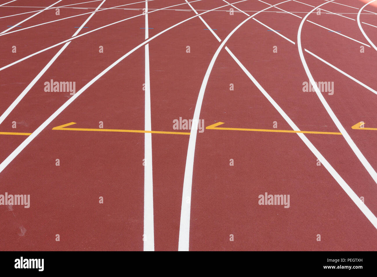 Red sport track for running on stadium shot on turn. Running healthy ...