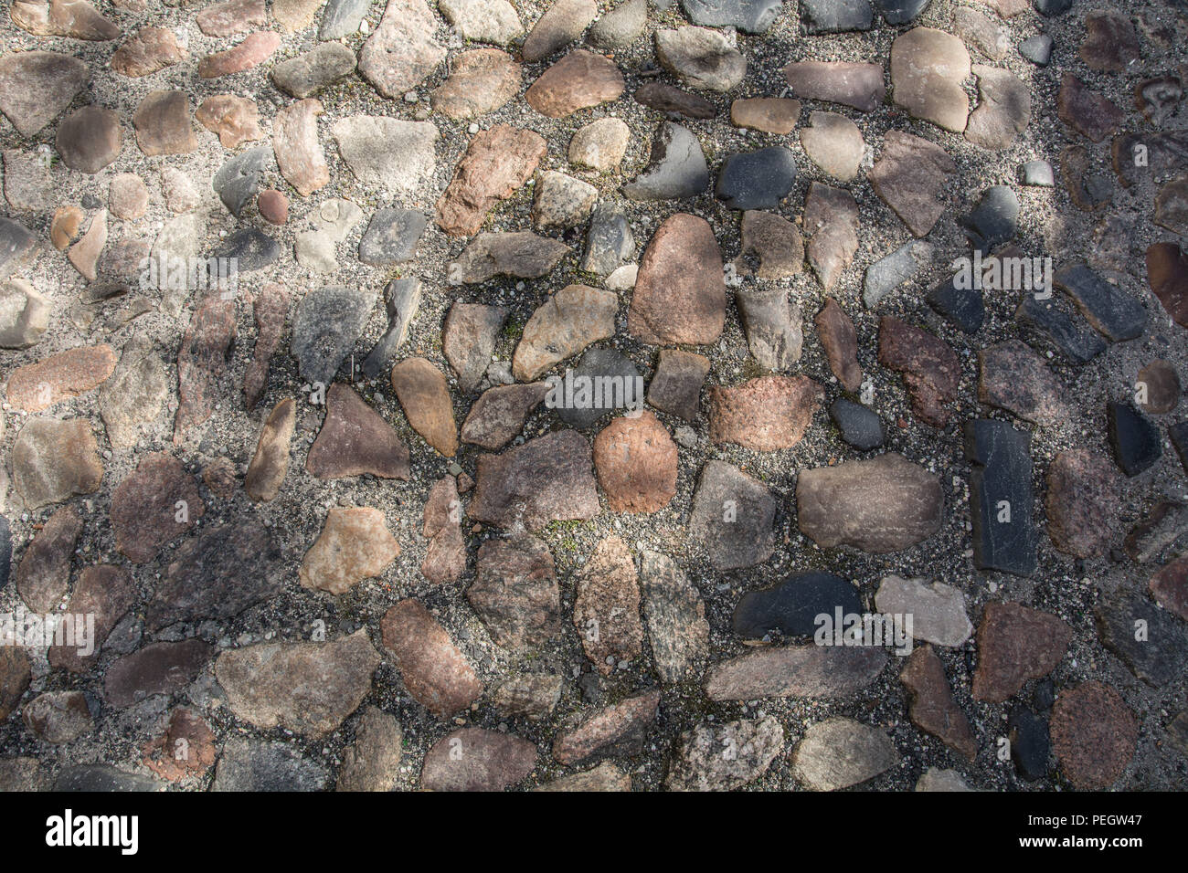 Stone large paving stones colorful road background Stock Photo - Alamy