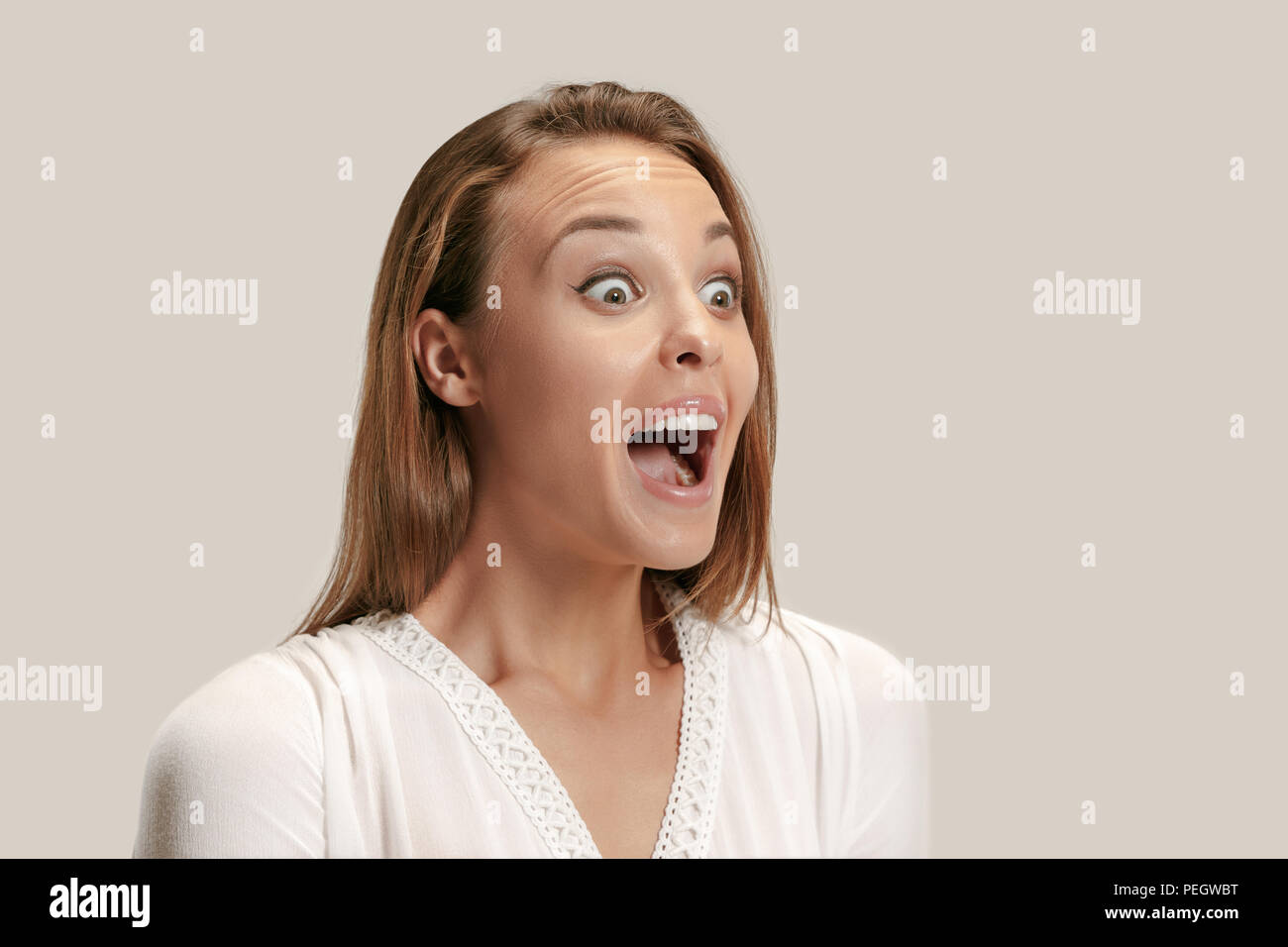 Delight. Beautiful female half-length front portrait isolated on gray ...