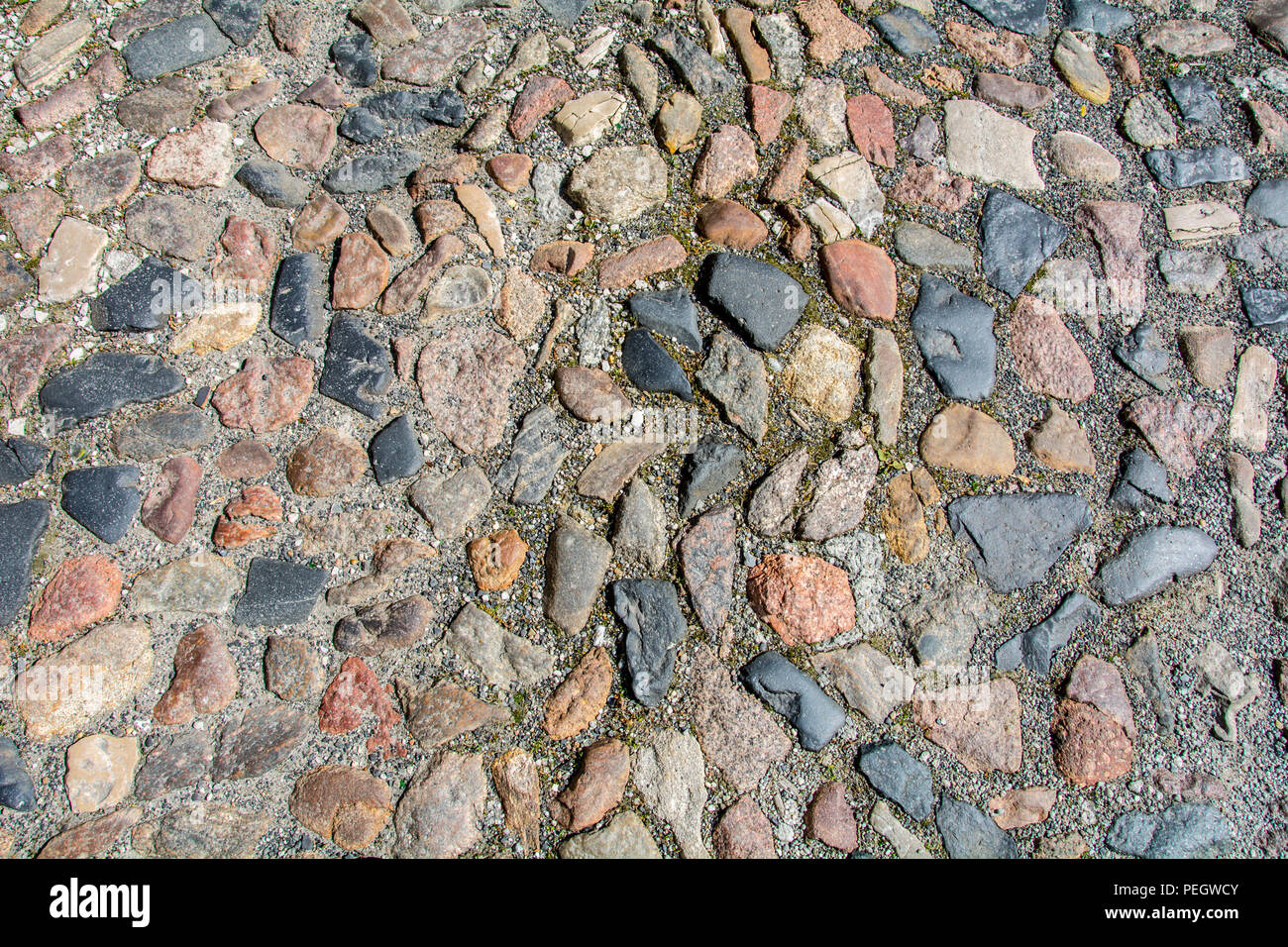 Stone large paving stones colorful road background Stock Photo - Alamy