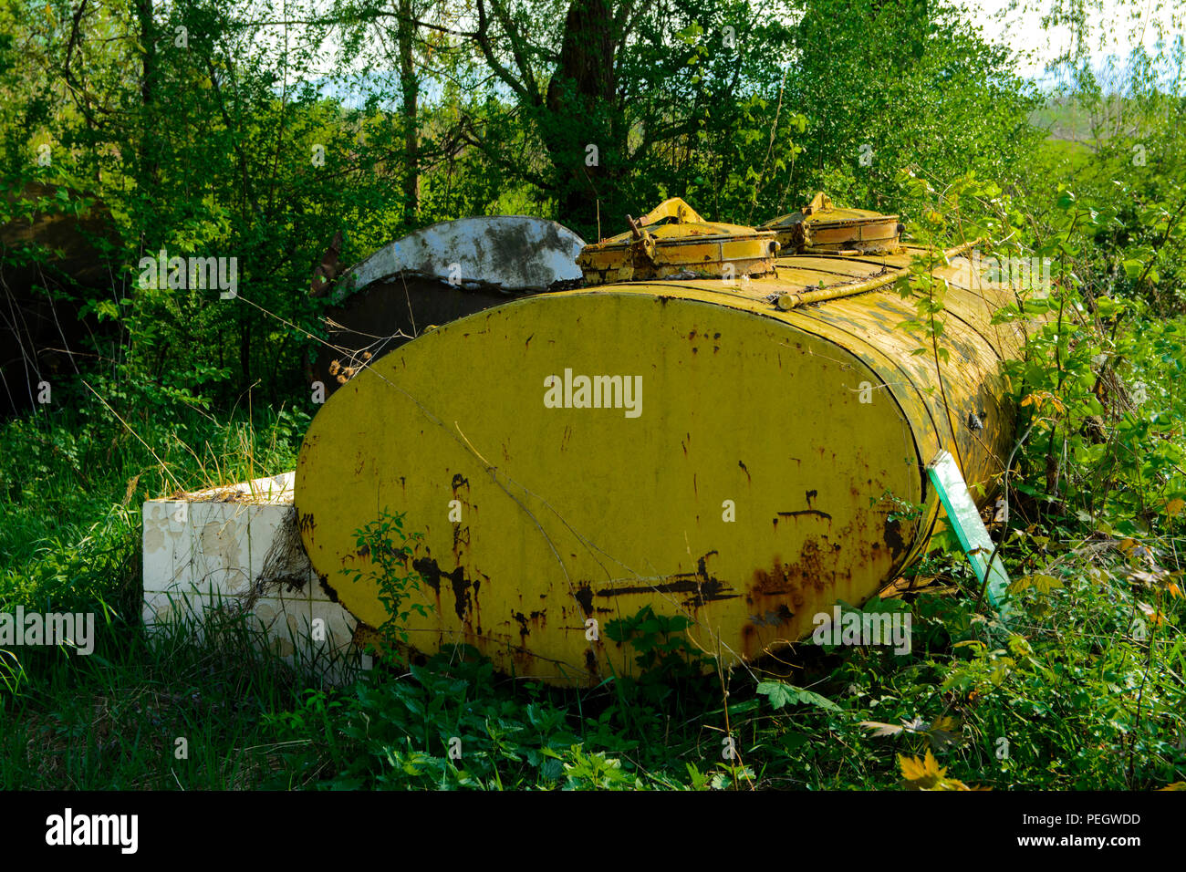Old abandoned iron rusty tanks and metal structures. The crisis, the ...