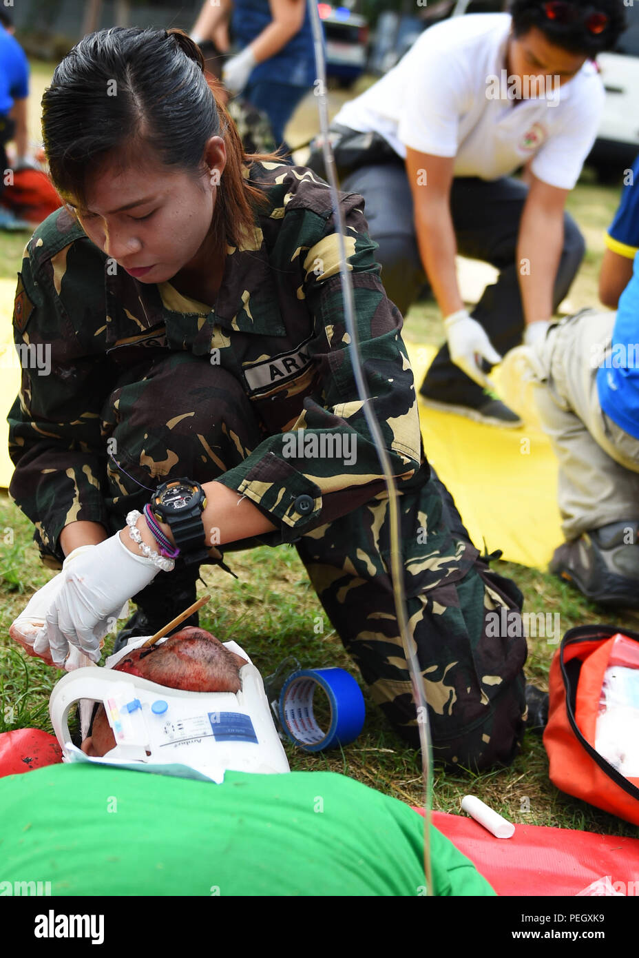 A member of the Philippine army prepares a patient with simulated ...