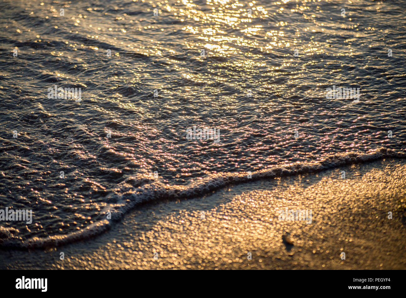 Waves with sun reflection Stock Photo - Alamy