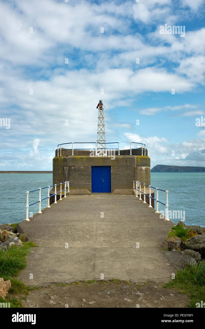 Light beacon at the end of a harbour breakwater Stock Photo - Alamy