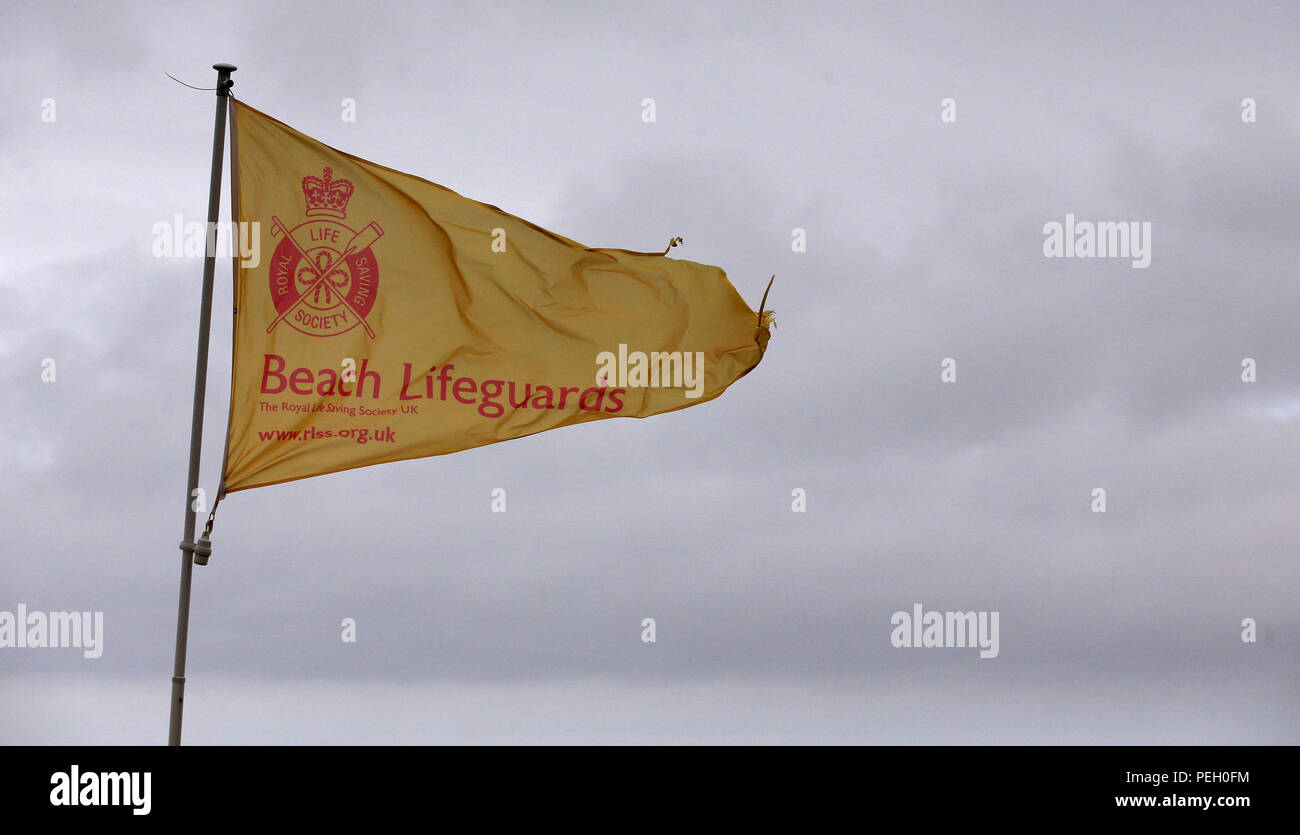 A Beach Lifeguards flag at North Shore in Blackpool, Lancashire Stock ...