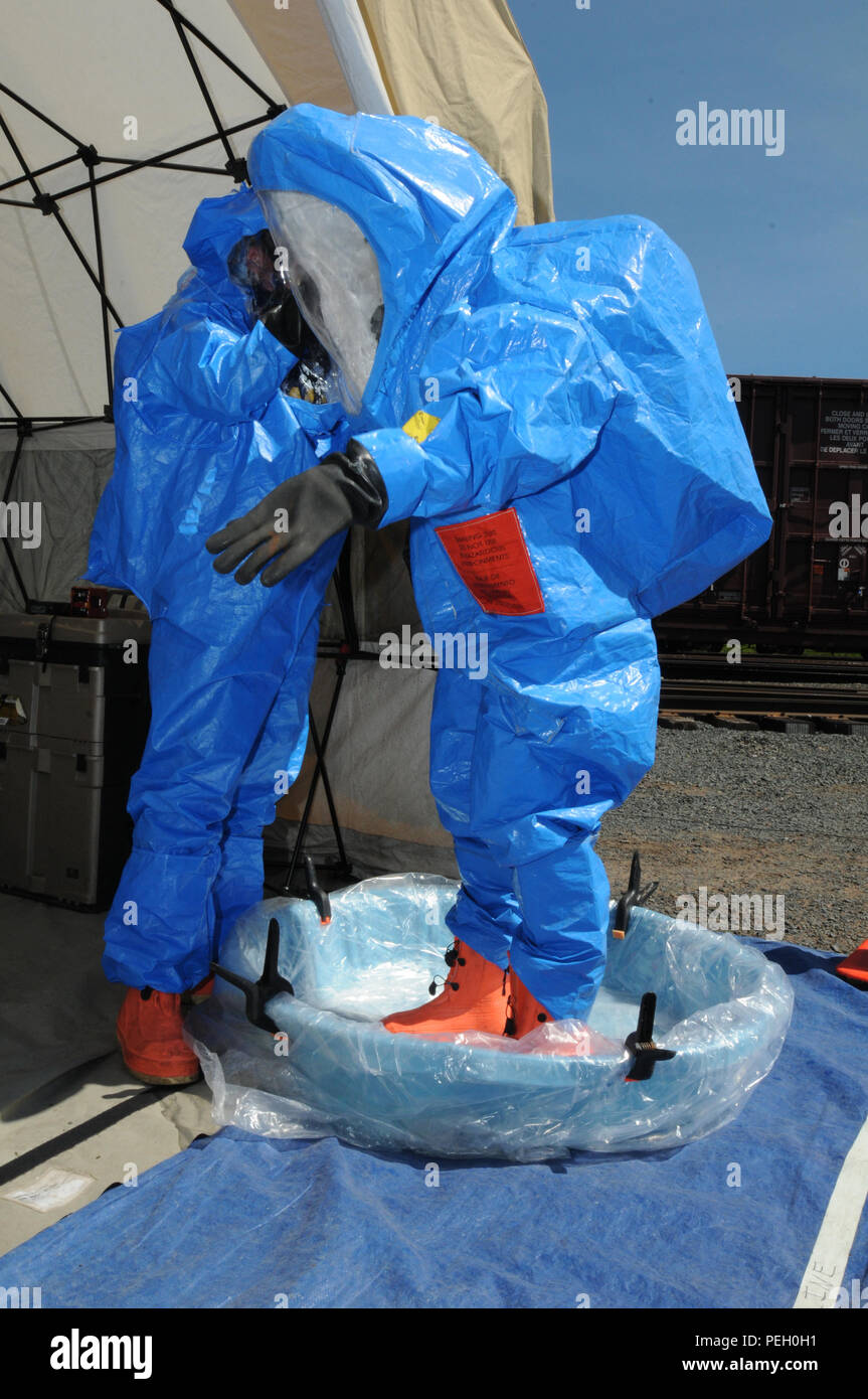 U.S. Air Force Staff Sgt. Ben Hein (left) assists U.S. Army Staff Sgt ...