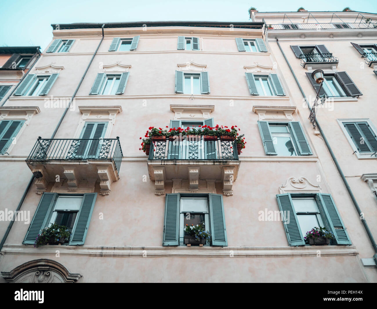 Beautiful facade of apartment building in Rome, Italy. Windows with ...