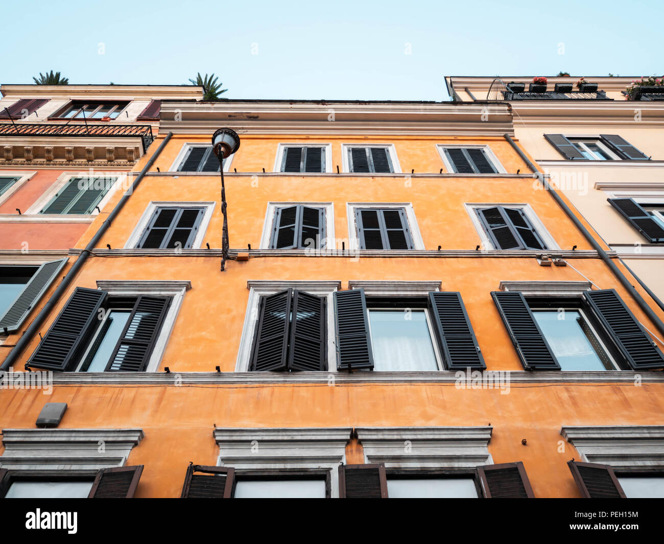 Beautiful facade of apartment building in Rome, Italy. Windows with ...