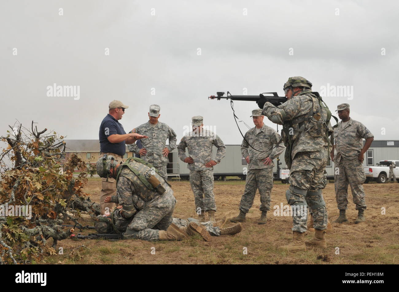 Command Sgt. Maj. Rodger M. Jones (standing, second from left), state ...