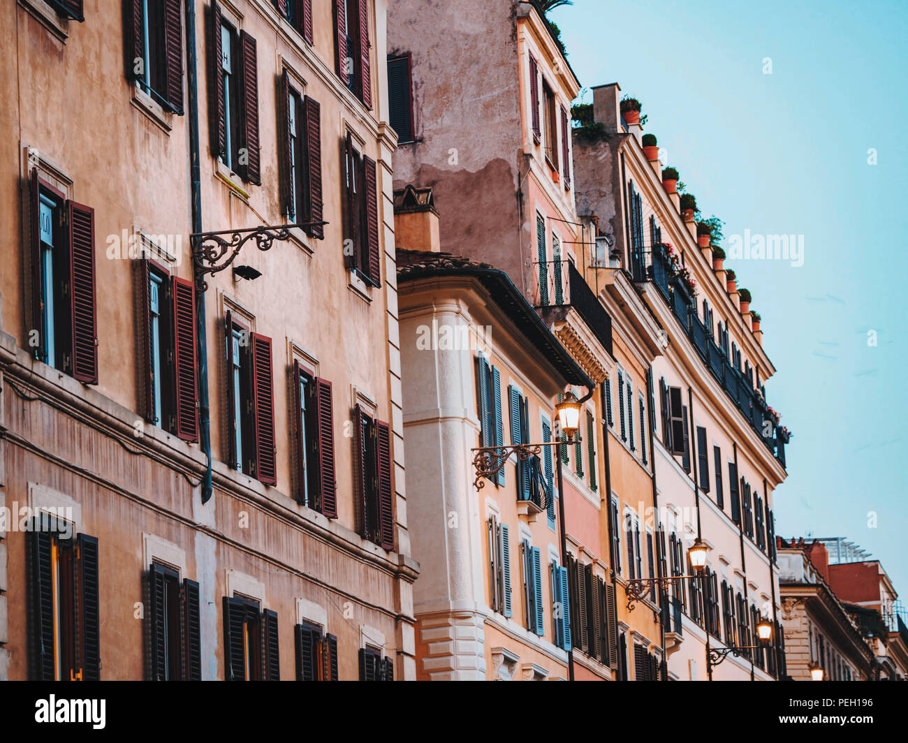 Beautiful facade of apartment building in Rome, Italy. Windows with ...