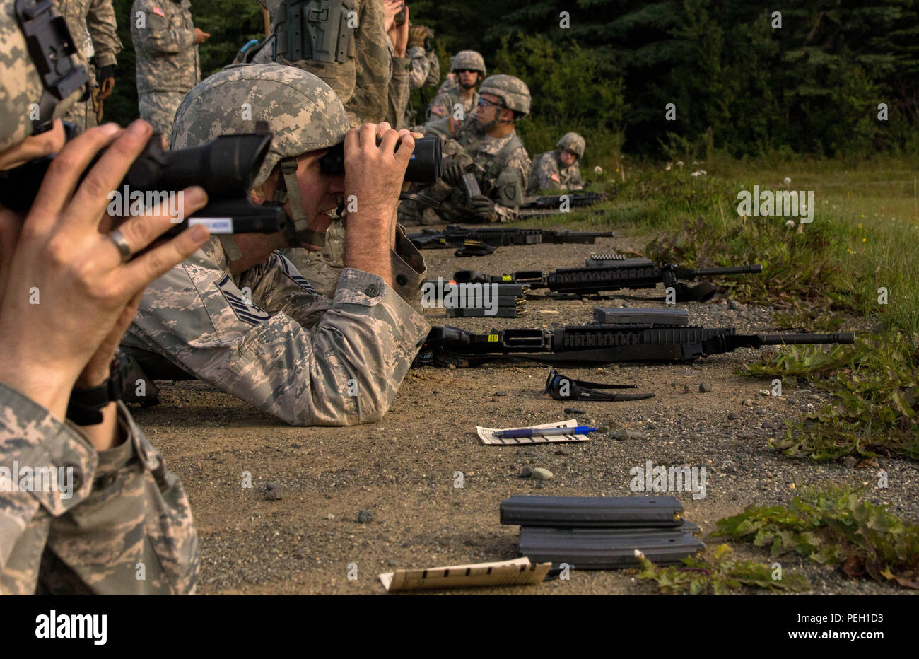 Alaska Army and Air National Guardsmen survey their targets from 200 ...
