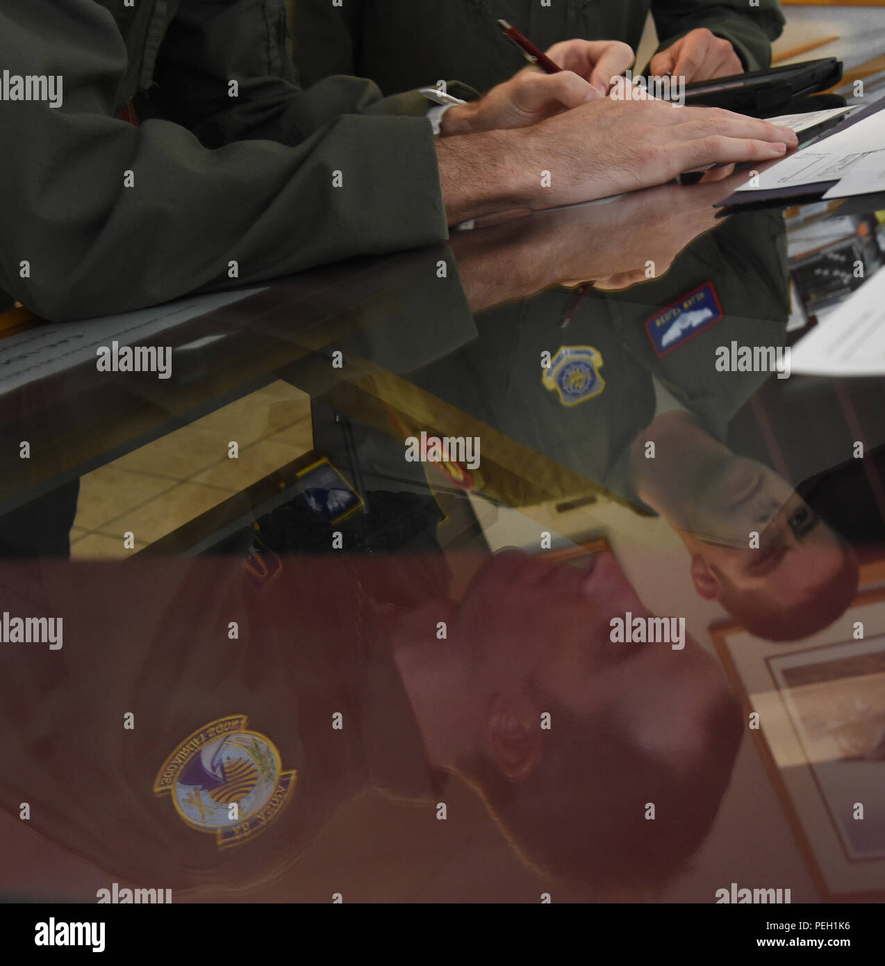 U.S. Air Force Maj. Matthew Thurber, left, a pilot assigned to the ...